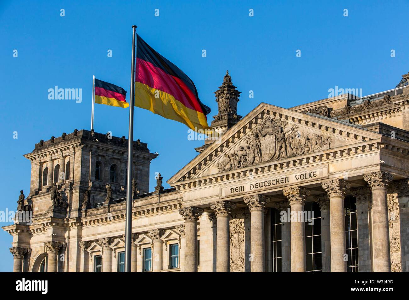 German flag flying next to the reichstag building hi-res stock ...