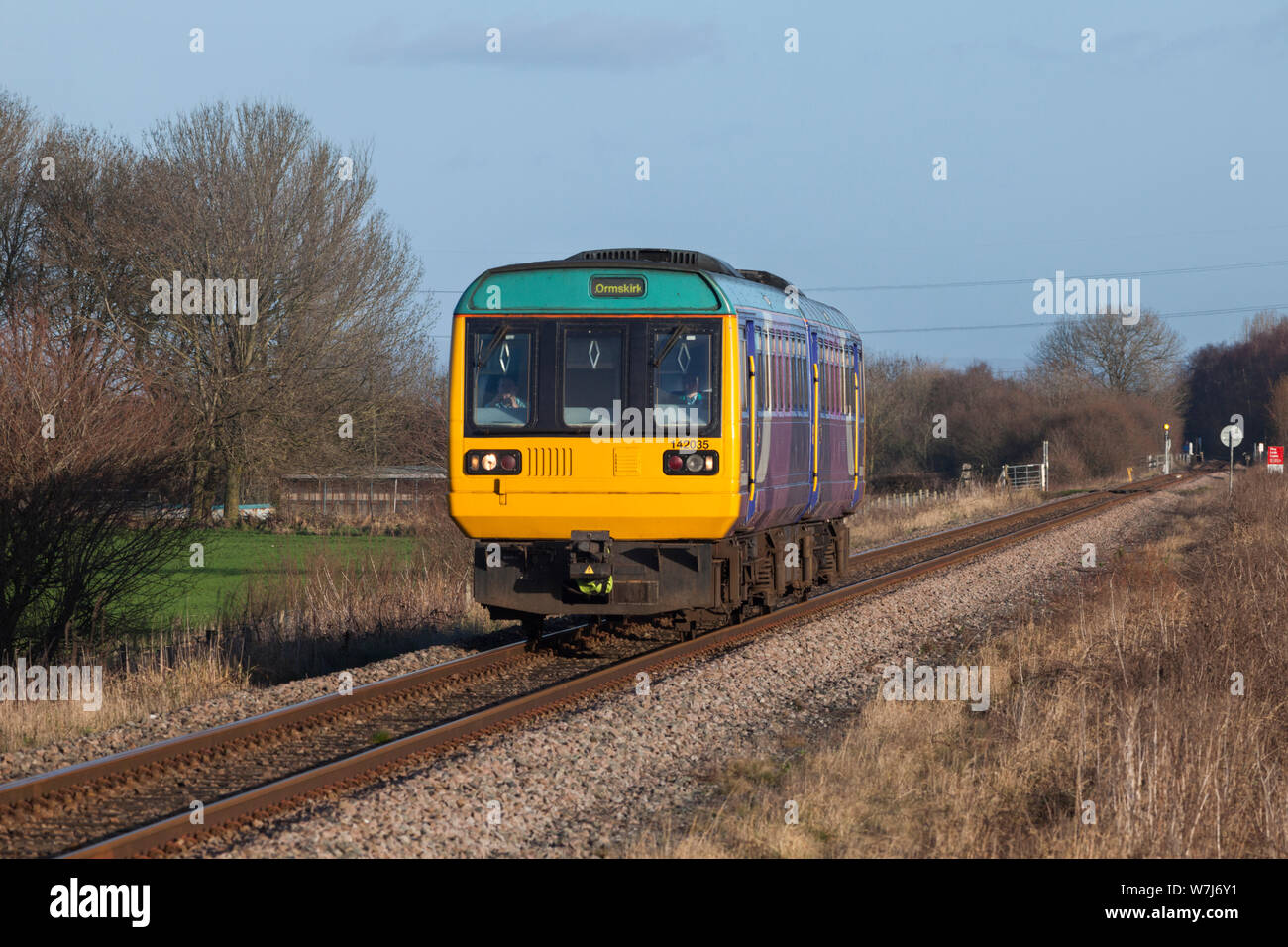Arriva northern Raol class 142 pacer train passing Farrington Moss on ...