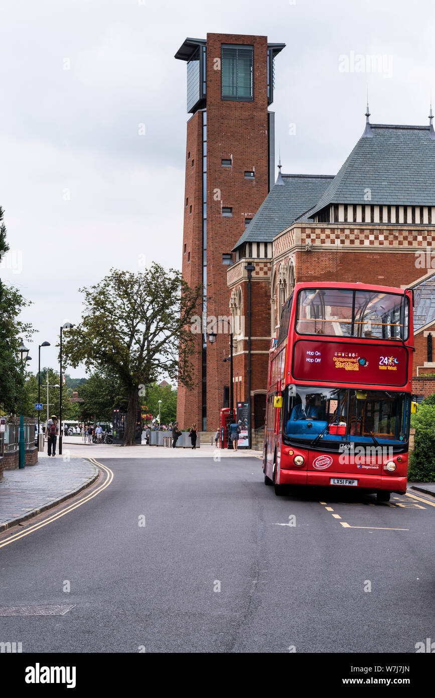 A view up Waterside with the RSC Theatre tower and a red double decker ...