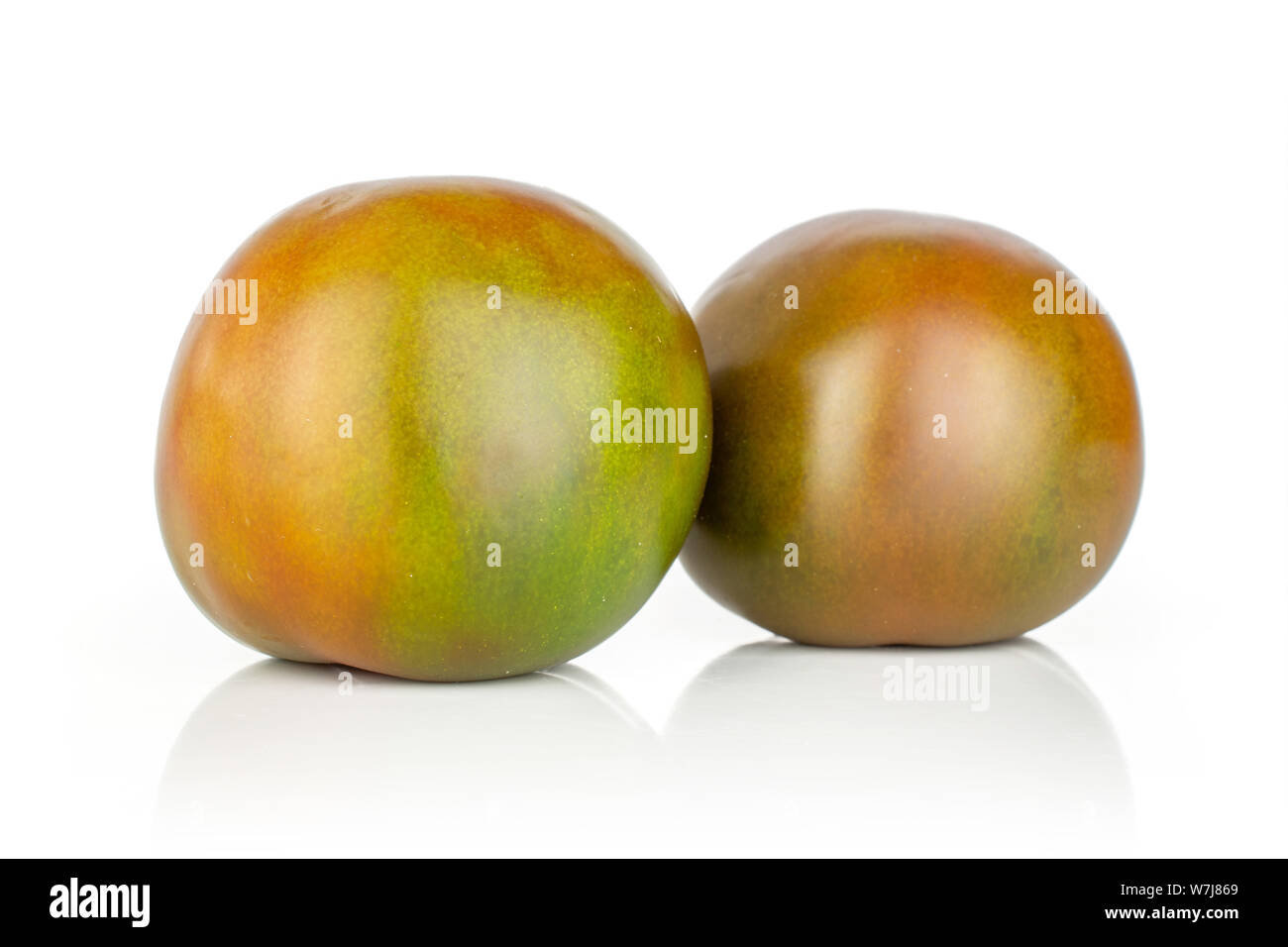 Group of two whole shiny fresh greenish red tomato isolated on white ...