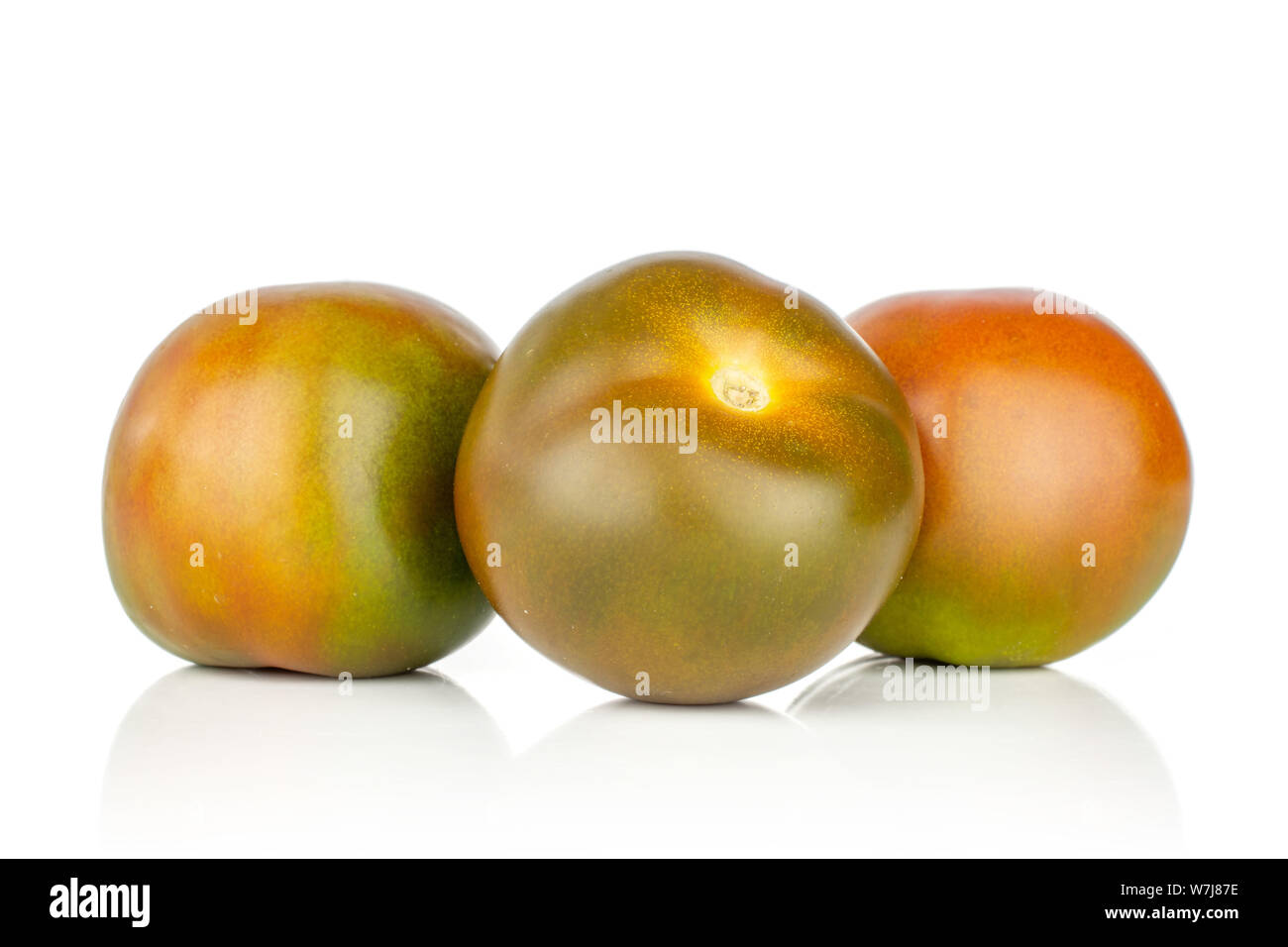 Group of three whole shiny fresh greenish red tomato isolated on white ...