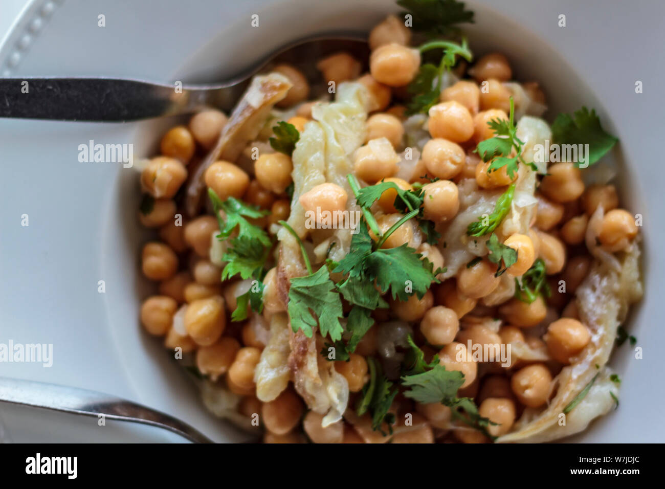 Top view of chickpeas salad with cod and coriander Stock Photo - Alamy
