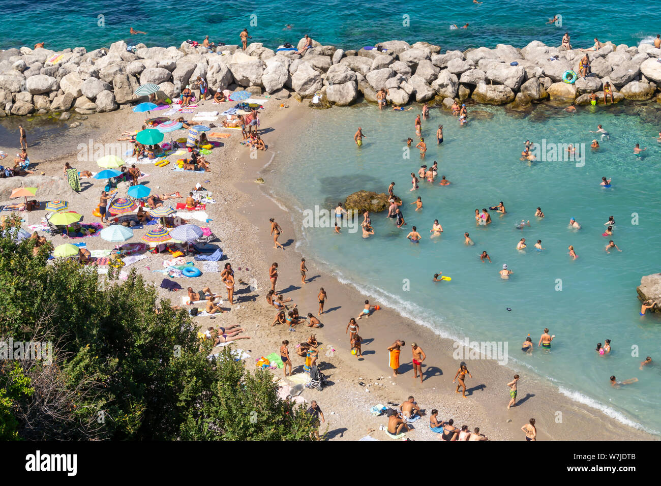 Isle of Capri, Italy - August, 2019: aerial view of bathers in Marina ...