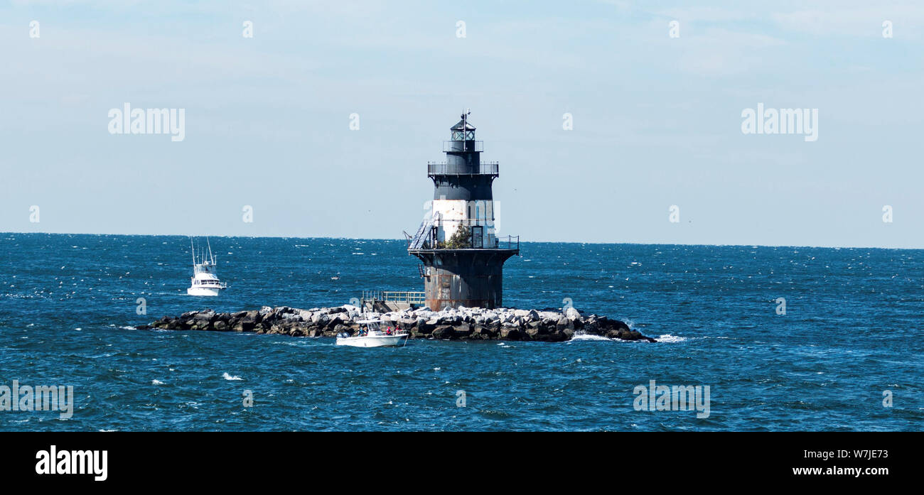 Picture of the Orient Point lighthouse taken from a boat, on a very ...