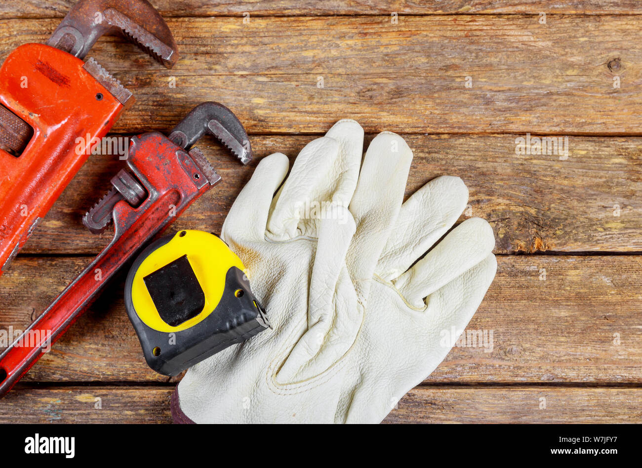 Plumbing wrench leather safety gloves construction concept Stock Photo ...