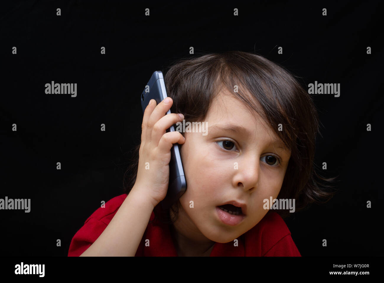 Little boy hold smartphone as modern mobile communication gadget Stock ...