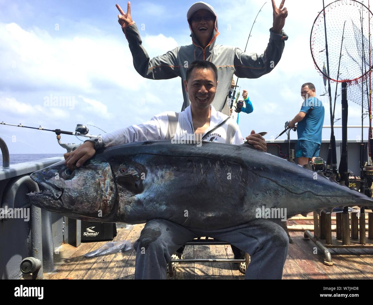 Chinese fishing enthusiast Wan Yongqin poses for photos with a 1.73 ...