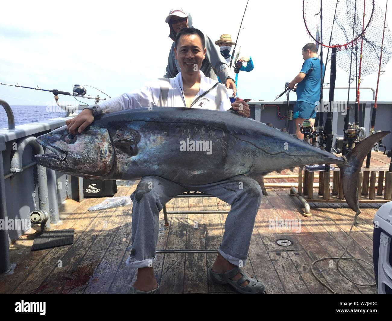 Chinese fishing enthusiast Wan Yongqin poses for photos with a 1.73 ...