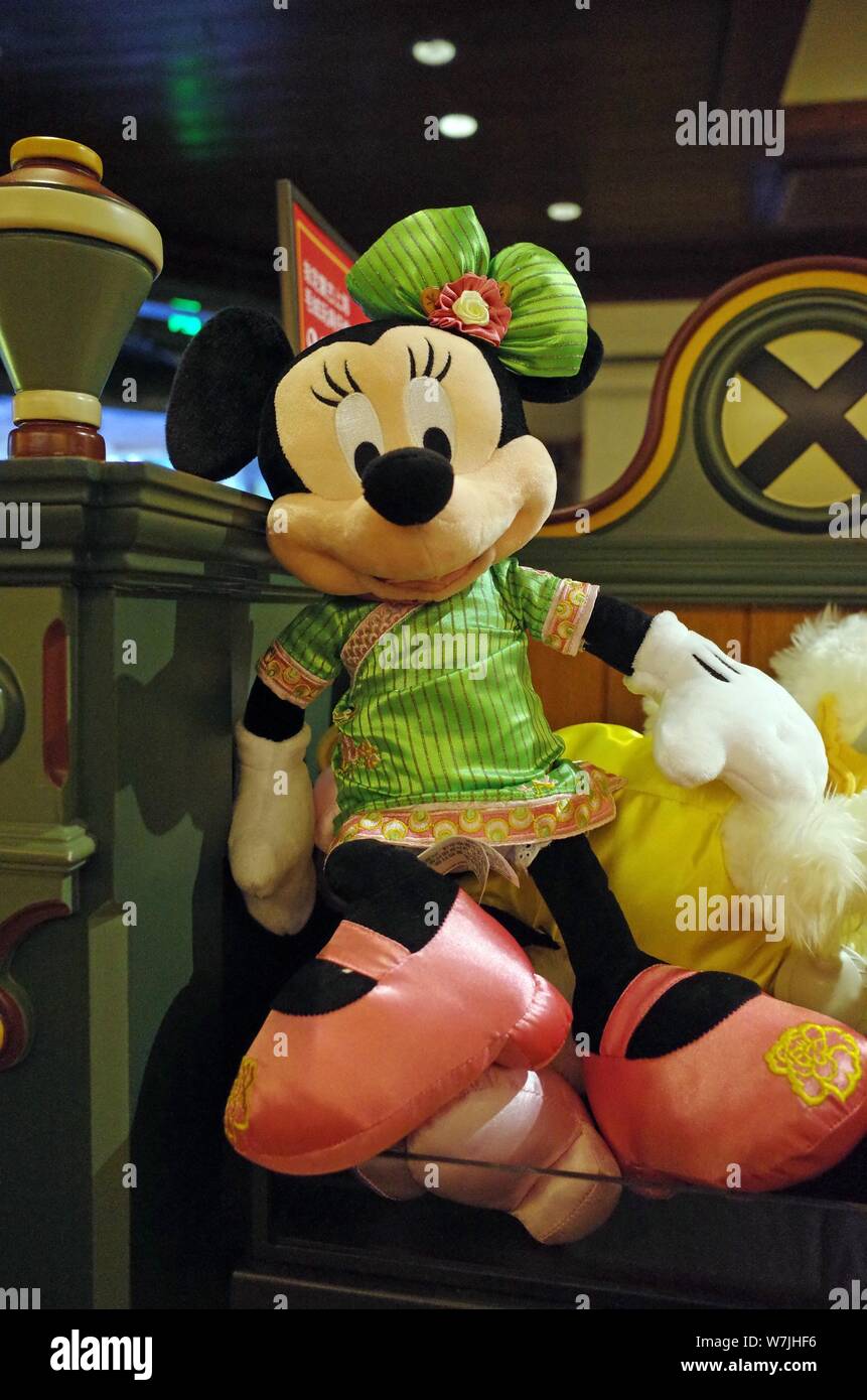 A Minnie Mouse doll dressed in traditional costume is on display at the ...