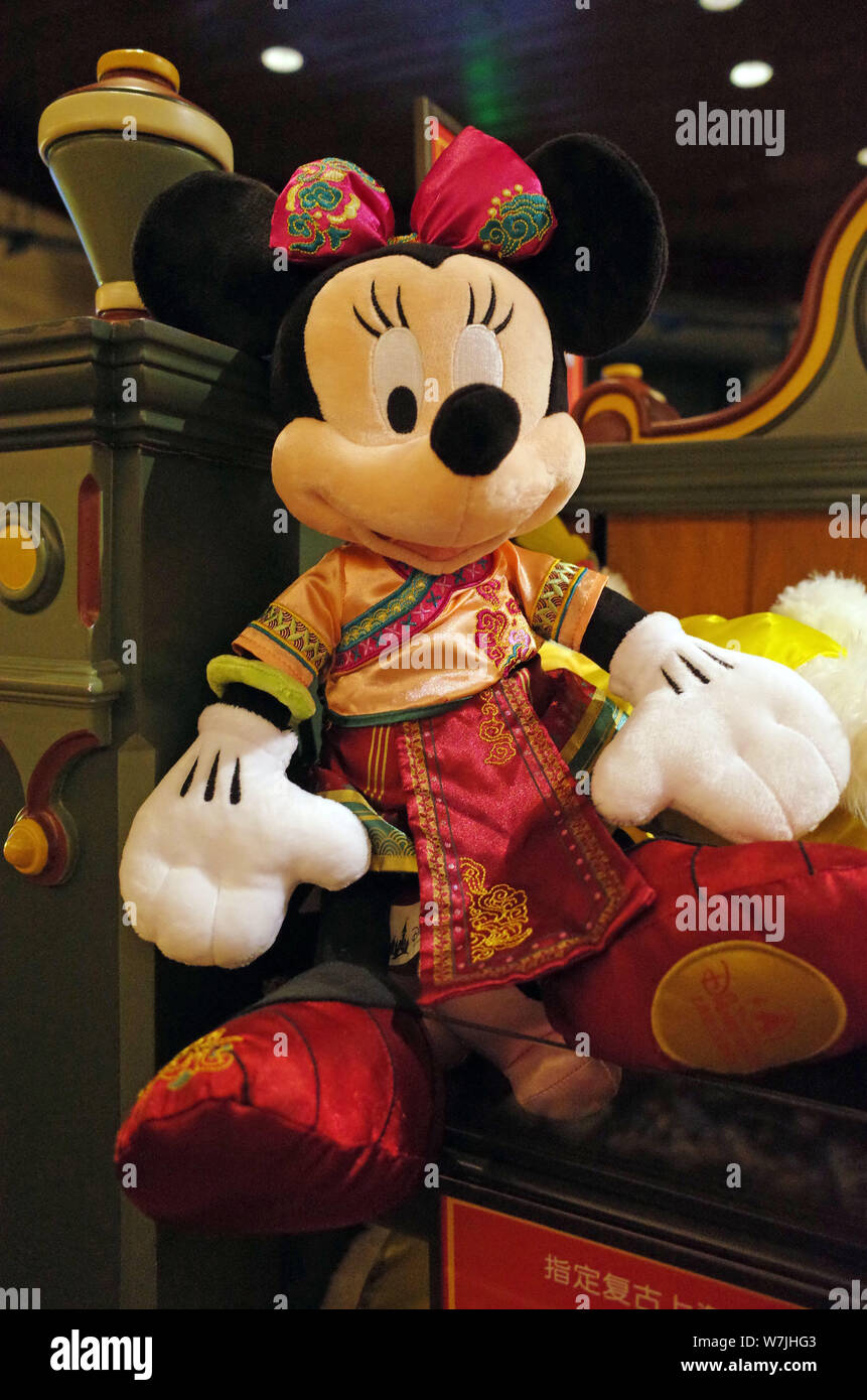 A Minnie Mouse doll dressed in traditional costume is on display at the ...
