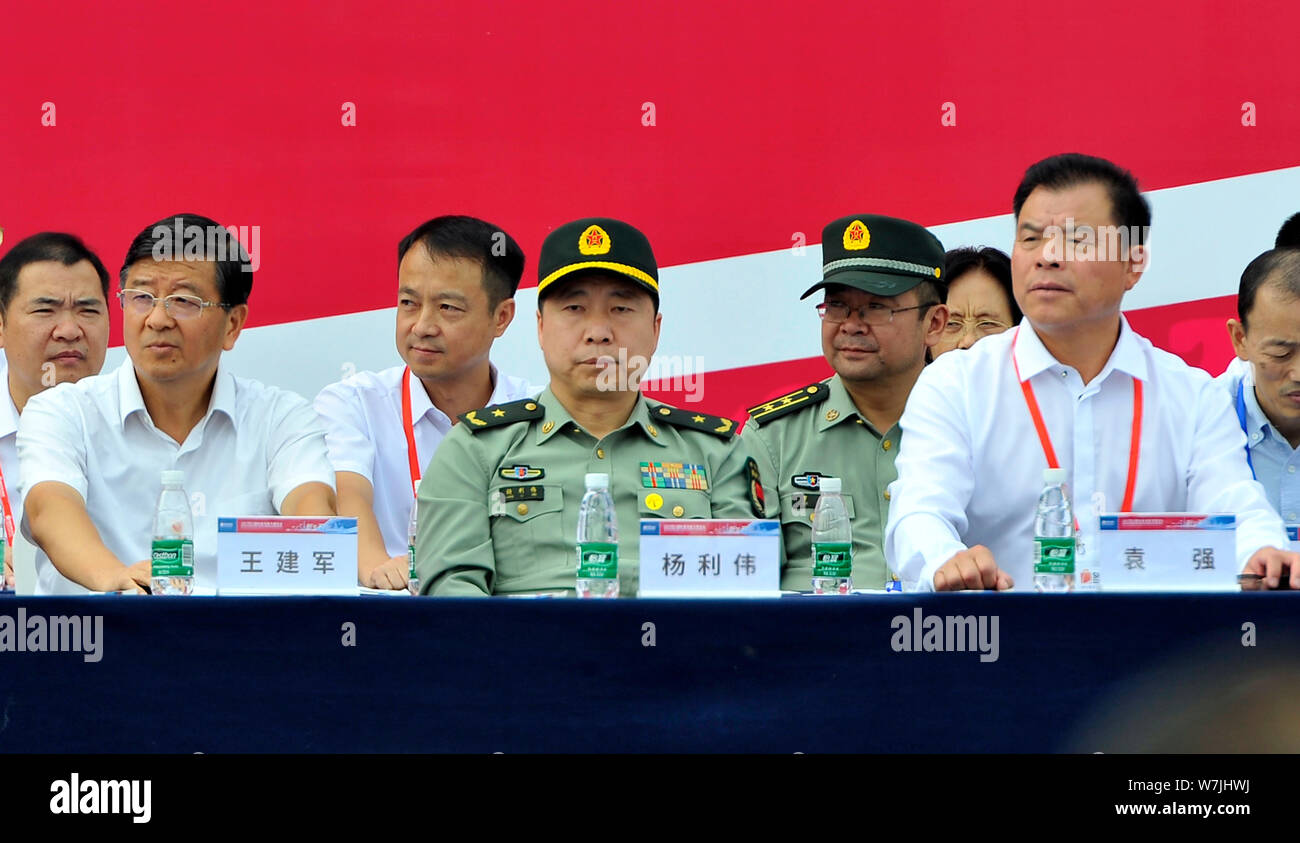 China's first astronaut Yang Liwei, center, attends the opening ...