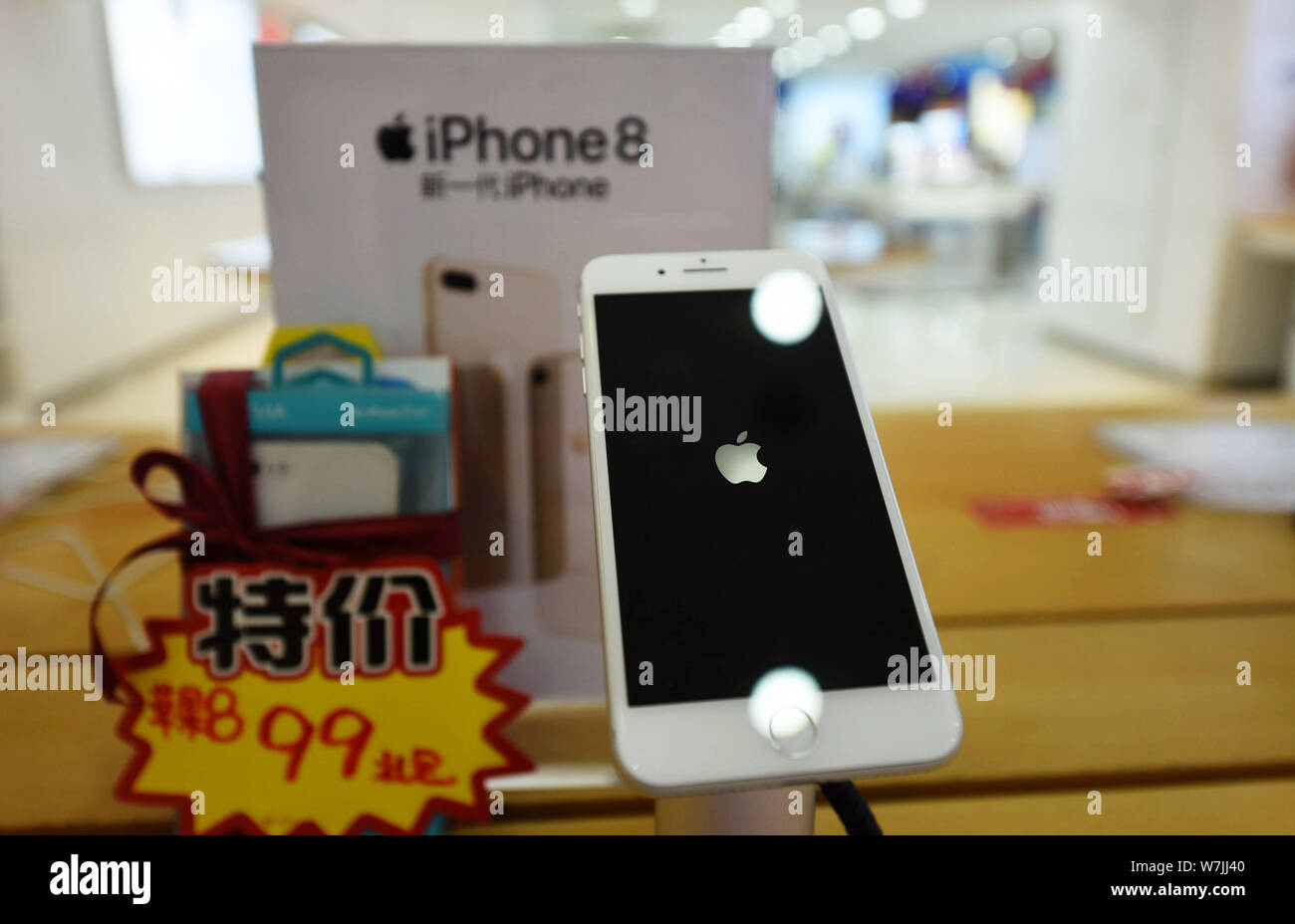 An iPhone 8 smartphone is on display at a flagship store of Apple in ...