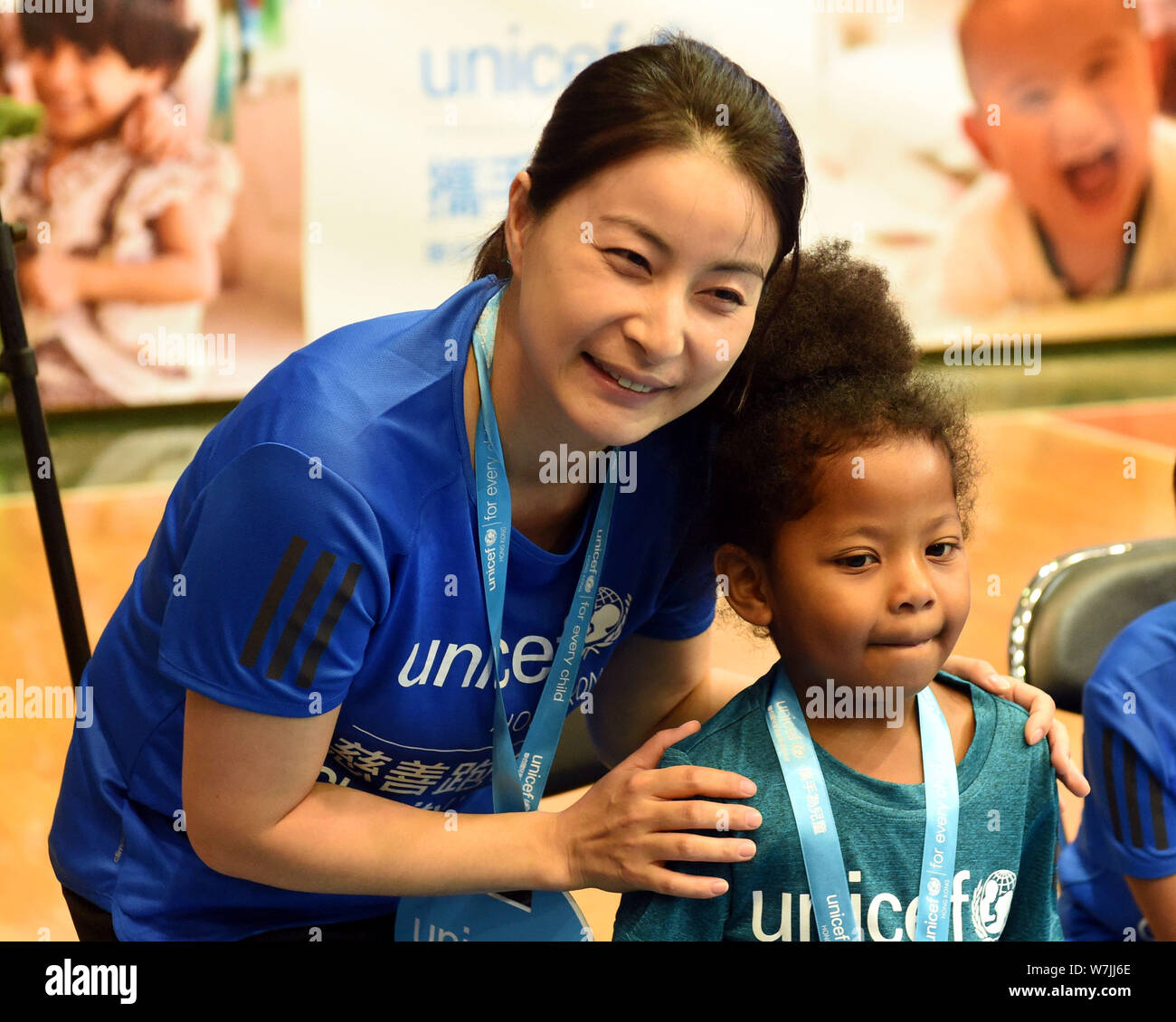 Chinese Olympic diving champion Guo Jingjing, left, who is married to ...