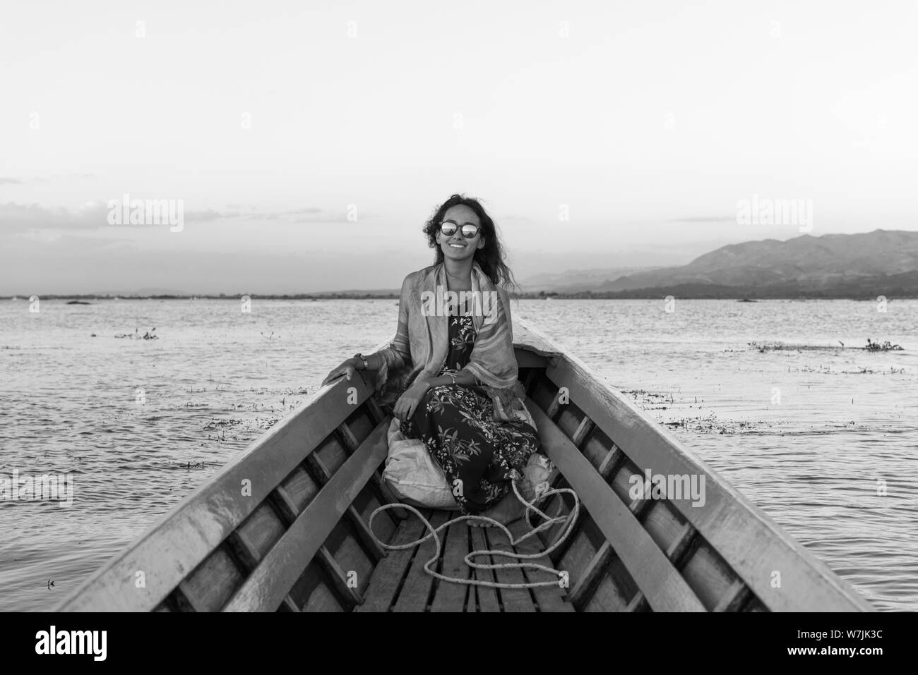 Black and white picture of a beautiful foreigner tourist smiling during ...