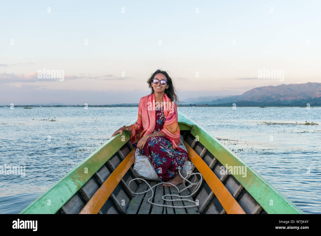 Horizontal picture of a beautiful foreigner tourist smiling during a ...