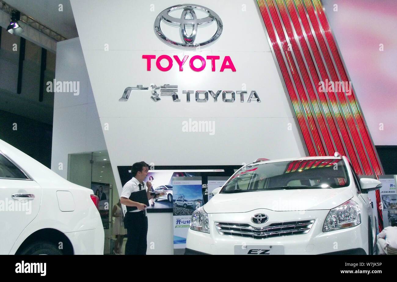 --FILE--A Chinese employee is seen at the stand of Toyota during an ...