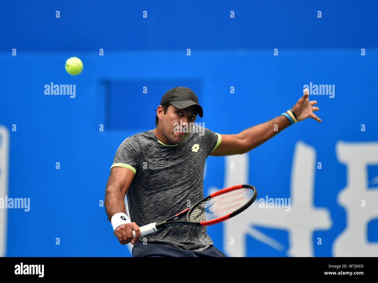 Aisam-ul-Haq Qureshi of Pakistan returns a shot to Taylor Fritz of ...