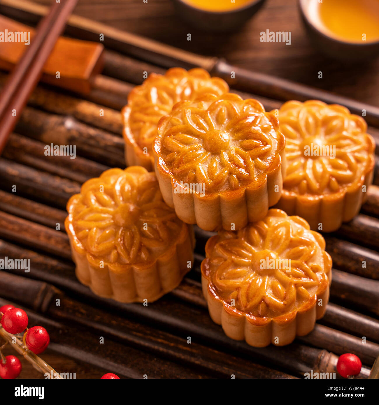 Chinese traditional pastry Moon cake Mooncake with tea cups on bamboo ...
