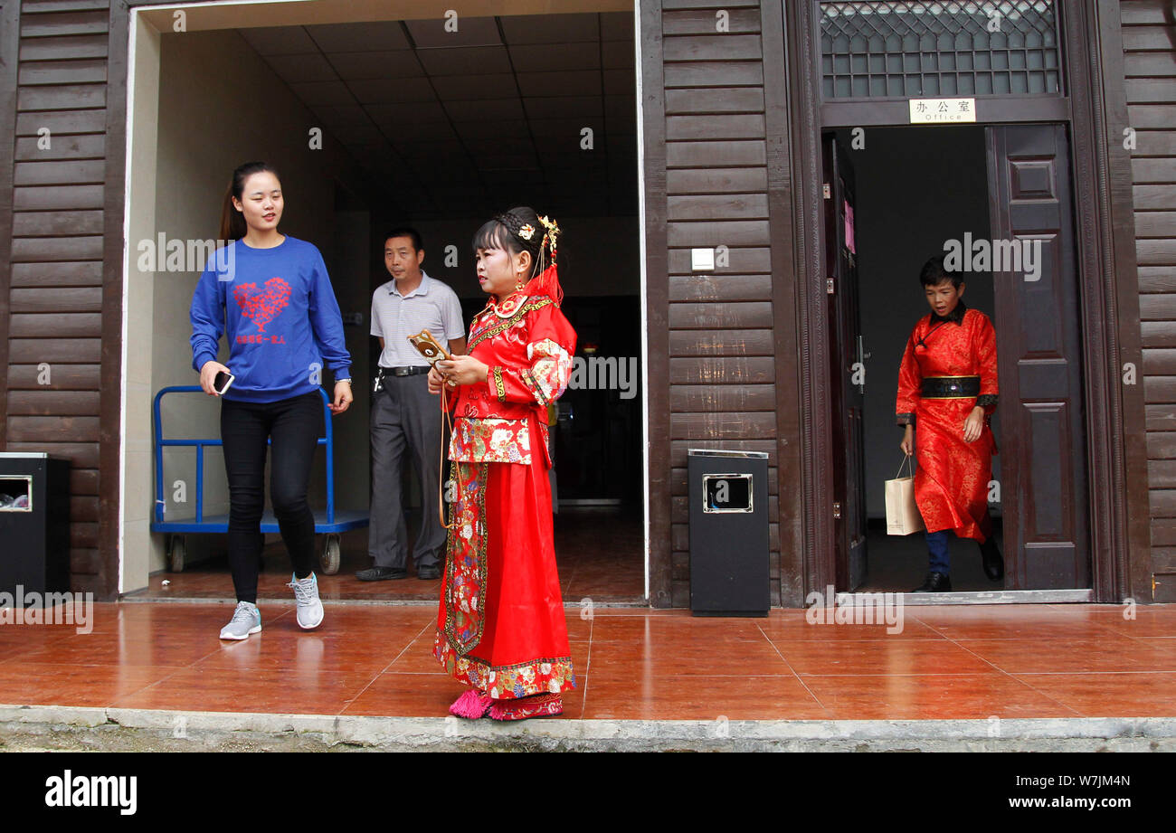 38-year-old Chinese bride Fei Yongling dressed in traditional costumes ...