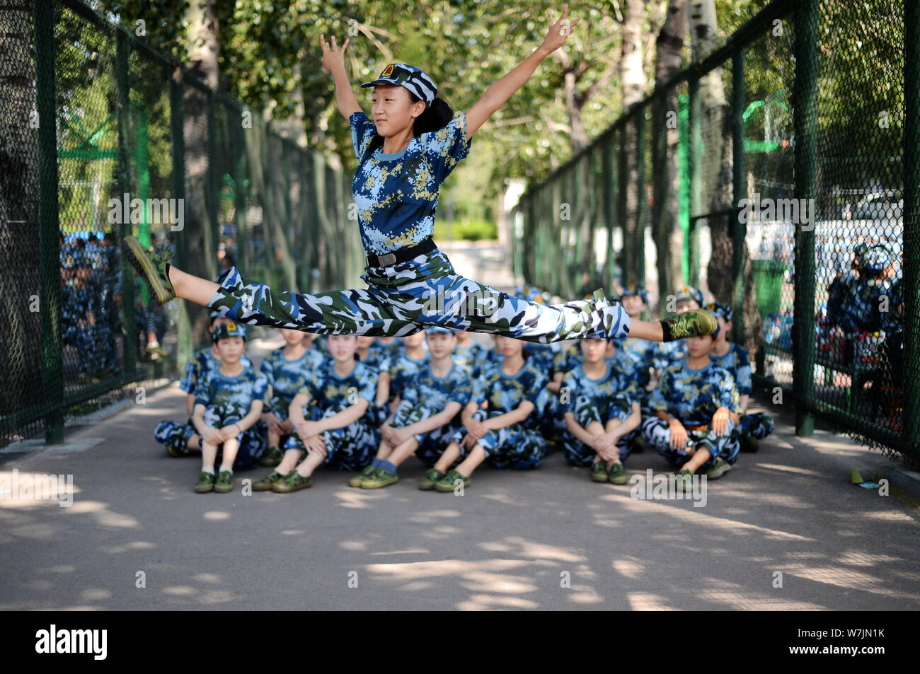 Chinese freshmen students majoring in dancing perform during a break in ...