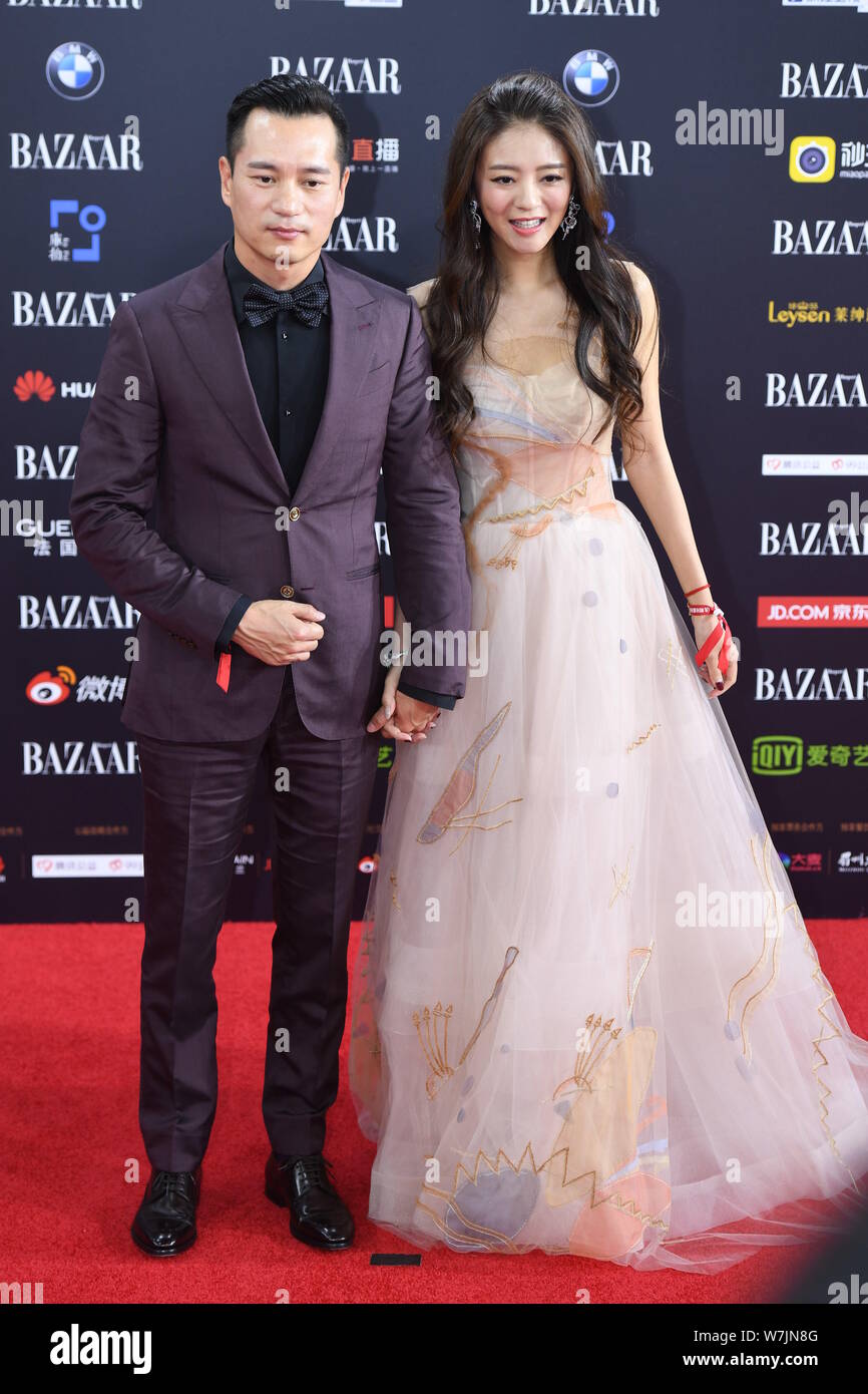 Taiwanese actress and singer Ady An Yi-xuan, right, and her husband Levo Chen pose as they ...