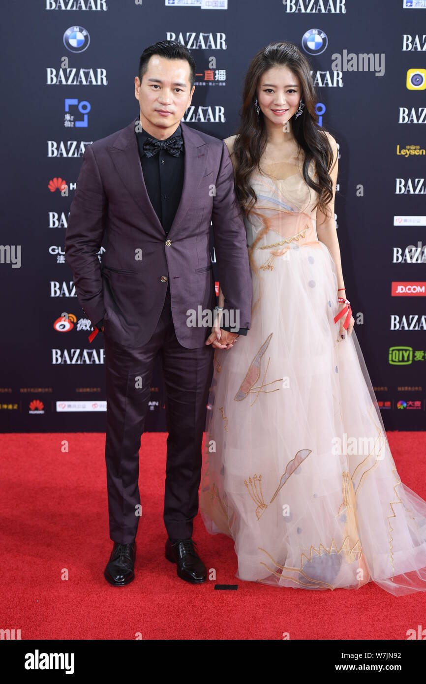 Taiwanese actress and singer Ady An Yi-xuan, right, and her husband Levo Chen pose as they ...