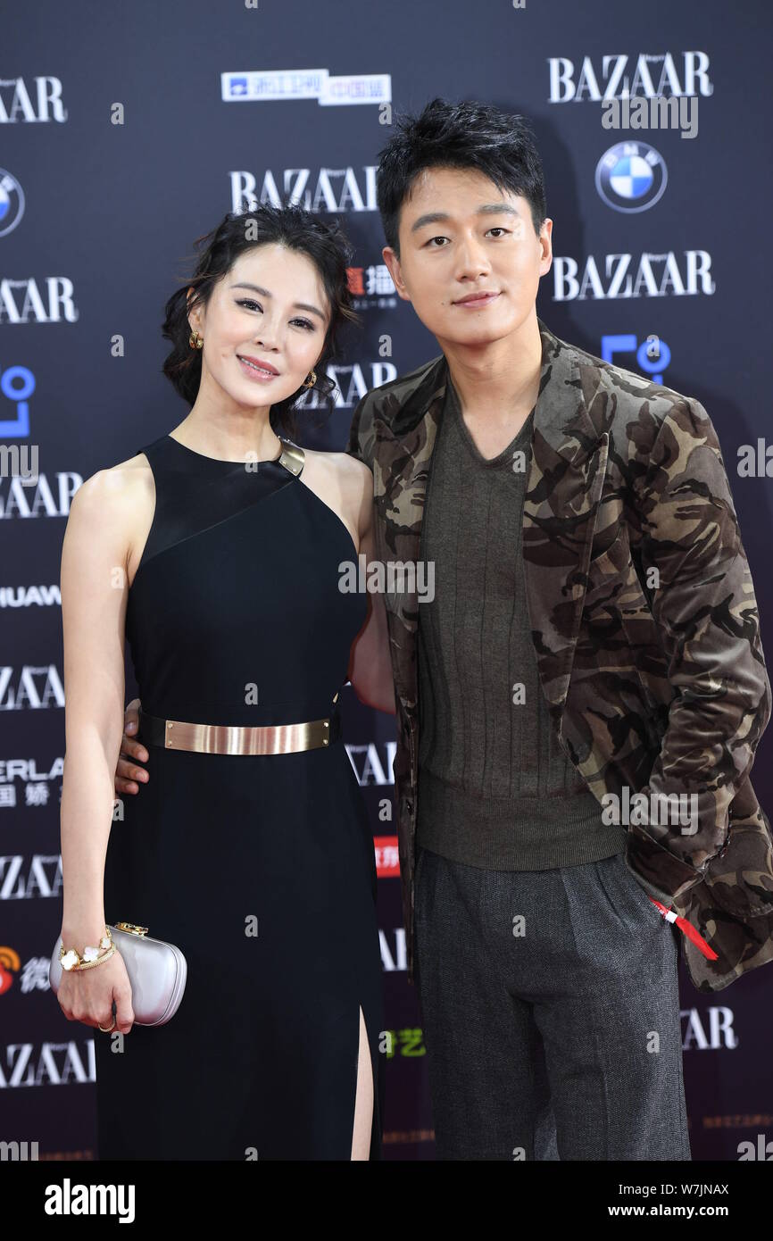 Chinese actress Guan Yue, left, and her actor husband Tong Dawei pose as they arrive on the red ...