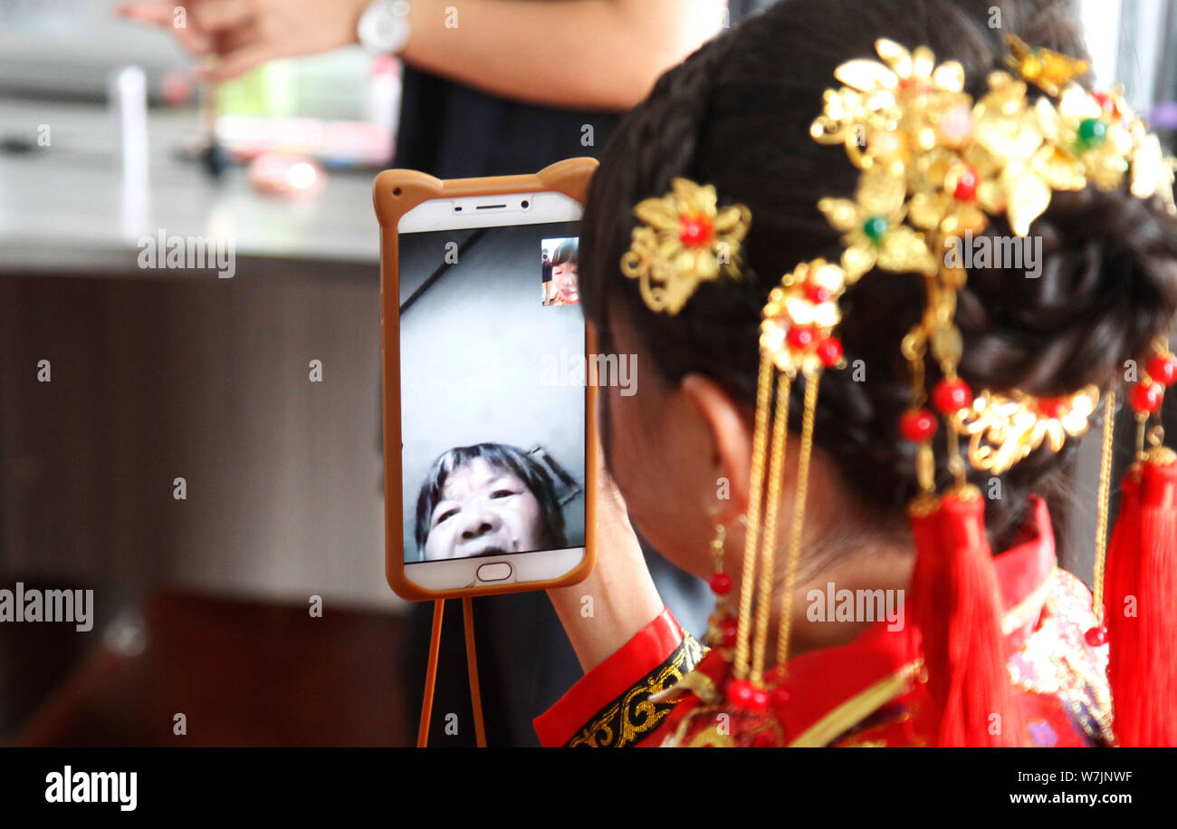 38-year-old Chinese bride Fei Yongling dressed in traditional costumes ...