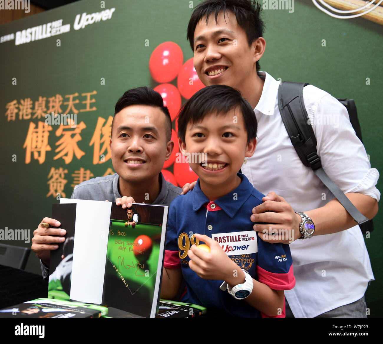 Hong Kong snooker player Marco Fu, left, talks with fans during a ...