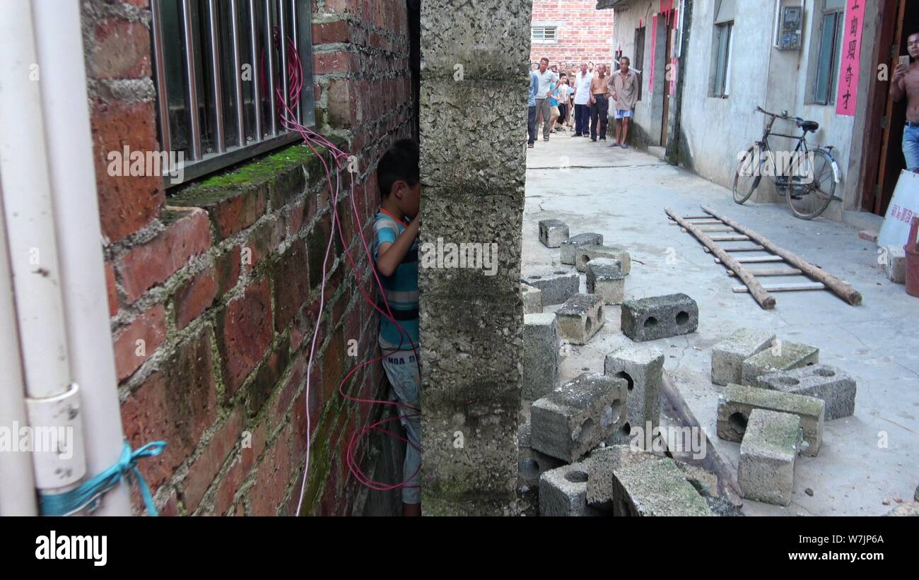 The head of a nine-year-old Chinese boy surnamed Huang gets stuck in a ...