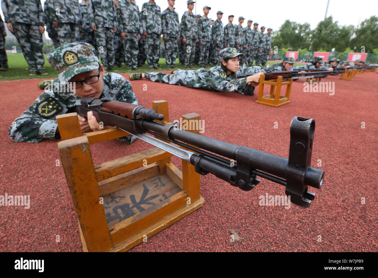 Freshmen from Southeast University practice shooting during a military ...