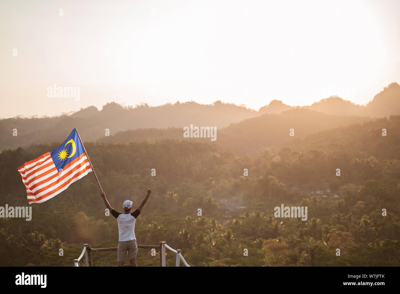 asian male with malaysian flag celebrating independence day Stock Photo ...