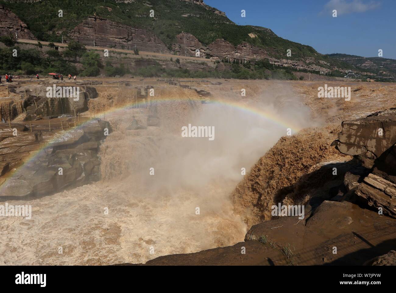 View of a rainbow stretching across the Hukou Waterfall on the Yellow ...