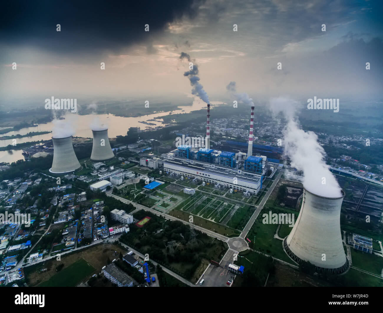 Smoke is discharged from chimneys at Jiangsu Xutang Power Plant of ...