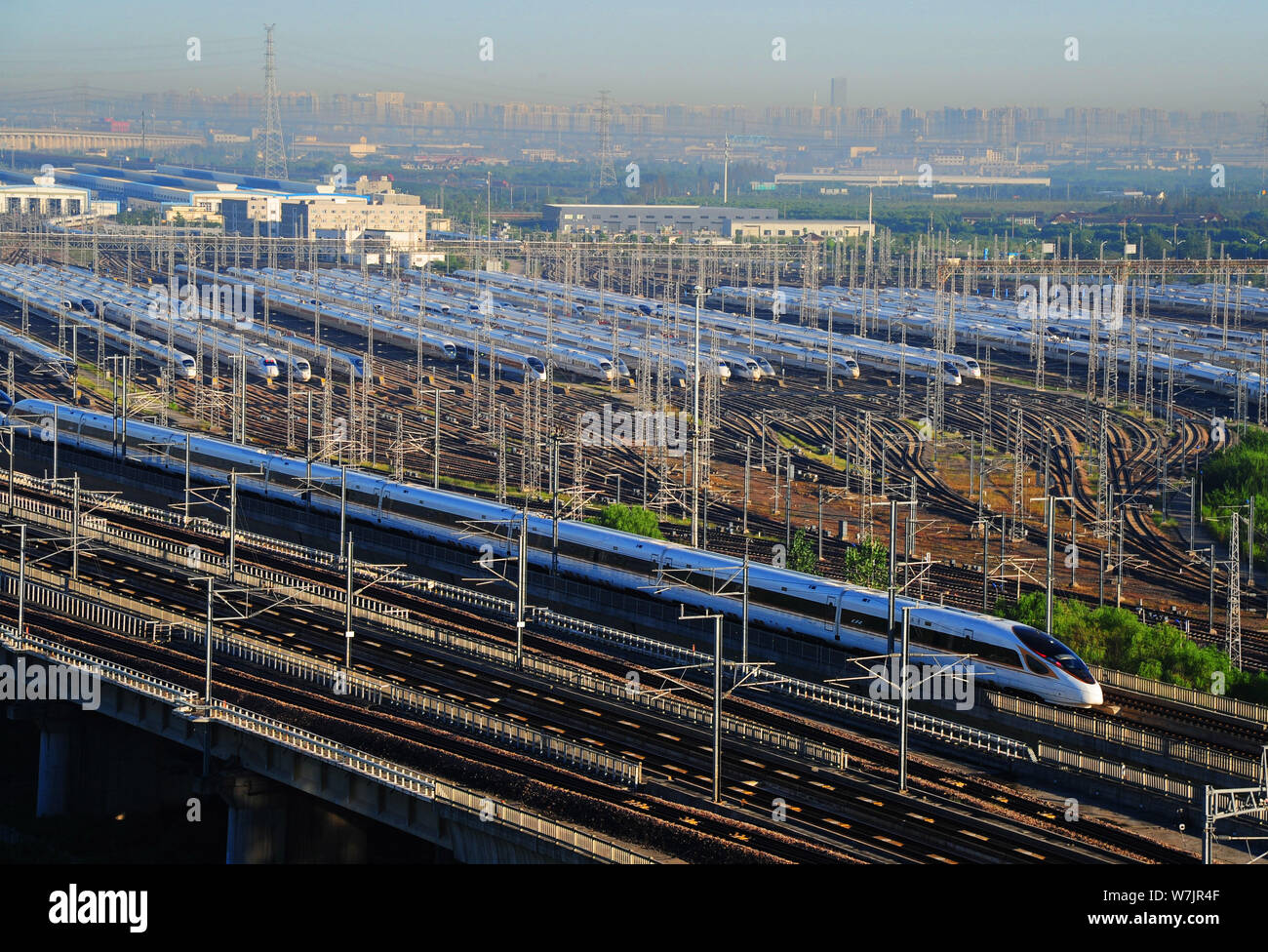 A high-speed bullet train leaves the Shanghai Hongqiao Railway Station ...