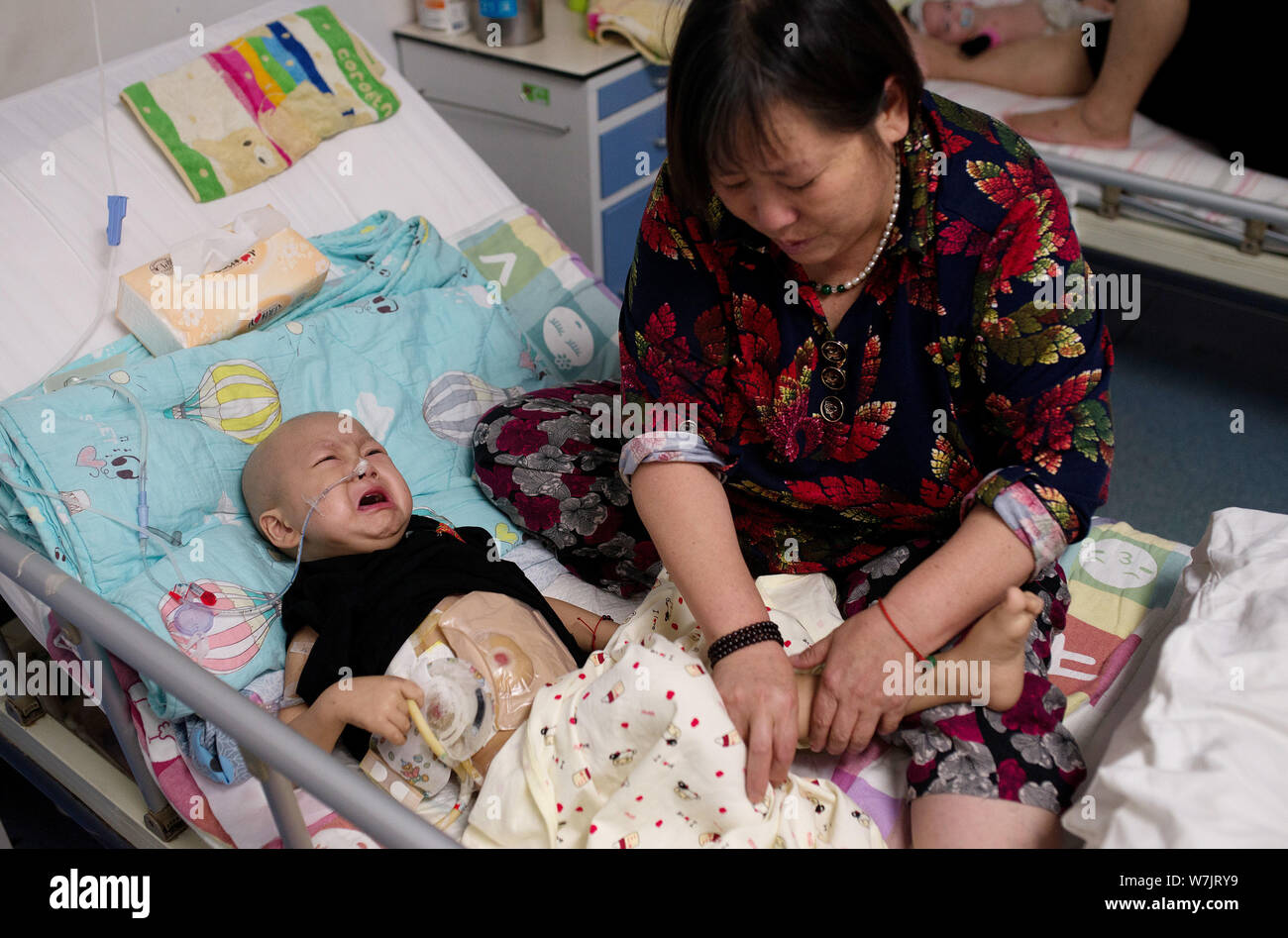Chinese boy hospital hi-res stock photography and images - Alamy