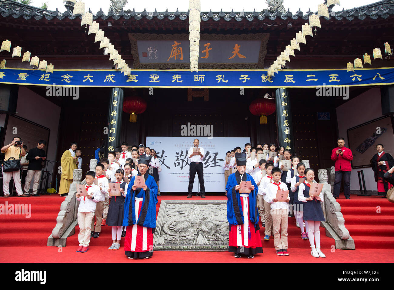 Participants dressed in traditional costumes perform a ritual to mark ...