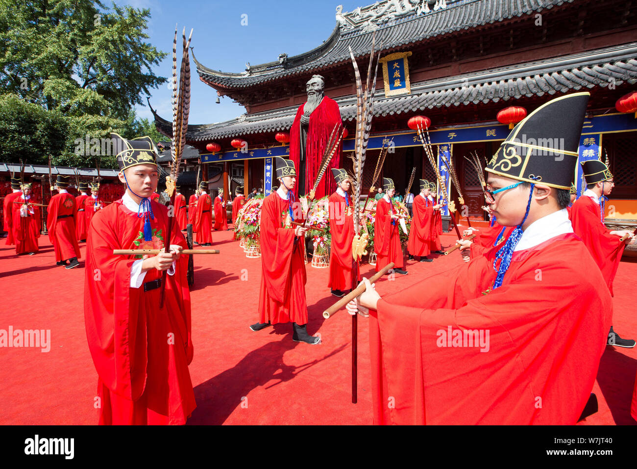 Participants dressed in traditional costumes perform a ritual to mark ...