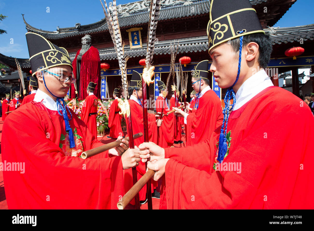 Participants dressed in traditional costumes perform a ritual to mark ...