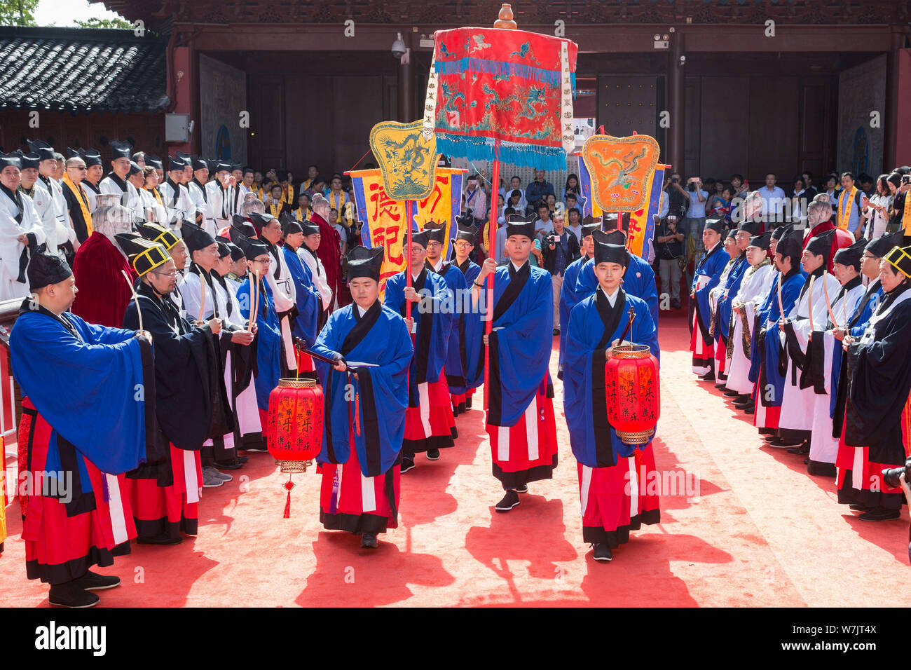 Participants dressed in traditional costumes perform a ritual to mark ...