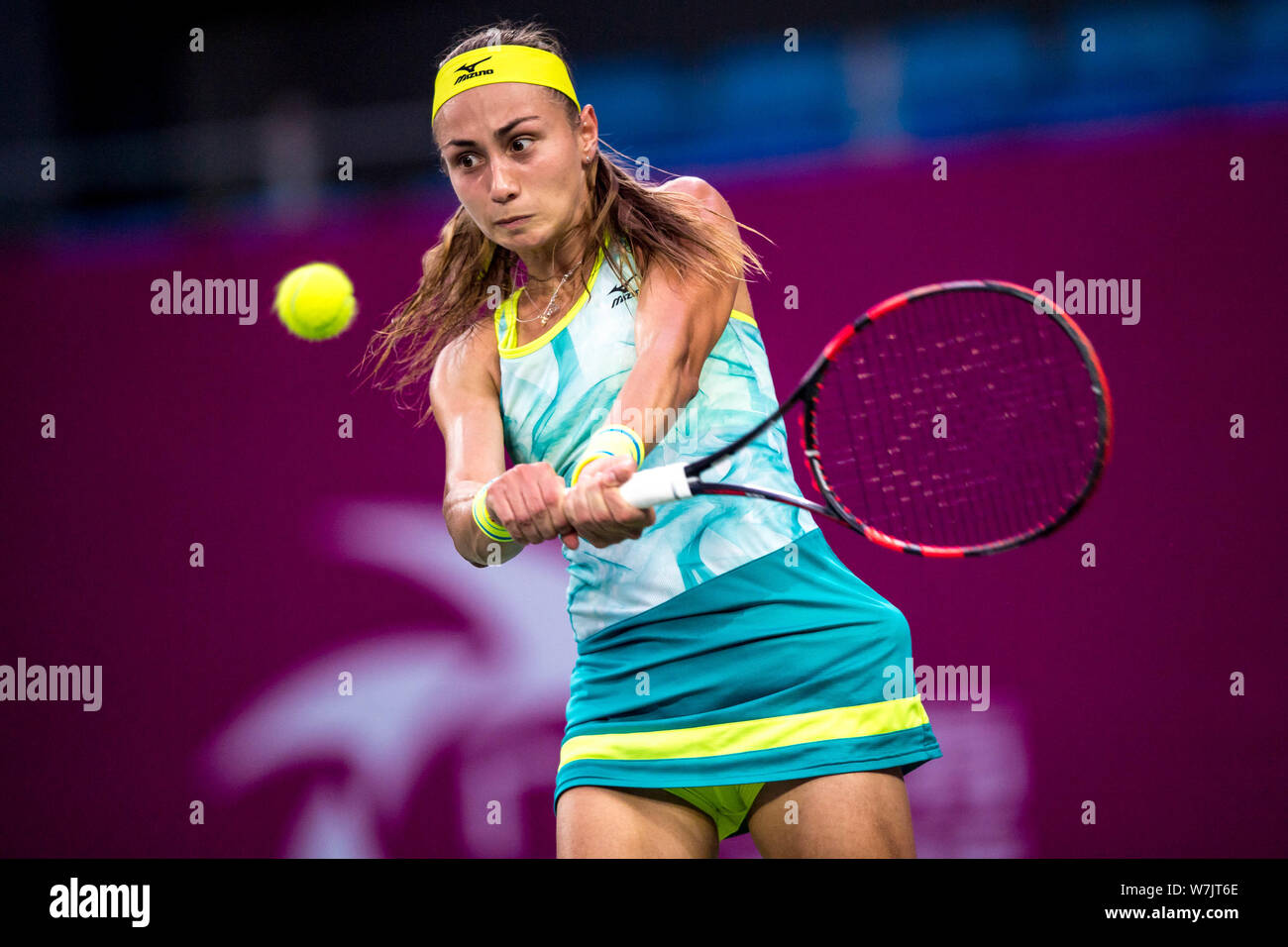 Aleksandra Krunic of Serbia returns a shot to Rebecca Peterson of ...
