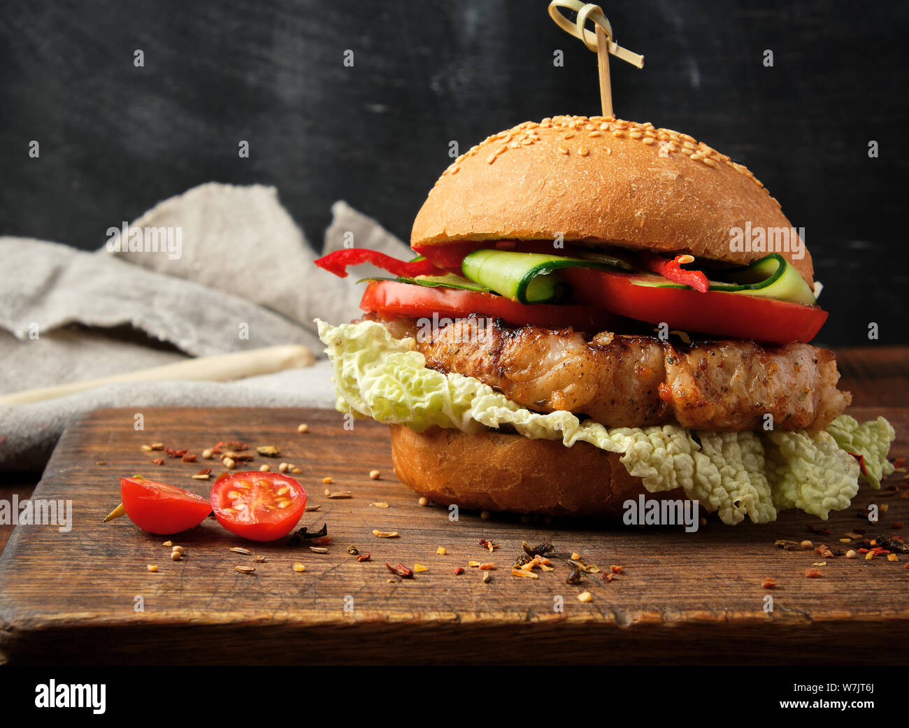 homemade hamburger with pork fried steak, red tomatoes, fresh round bun ...