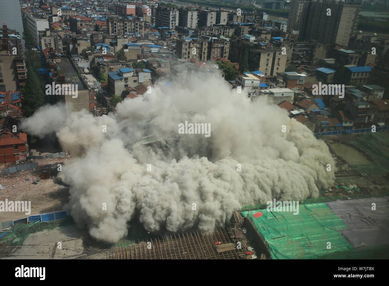 Heavy smoke rises after an old residential building exploded during a ...