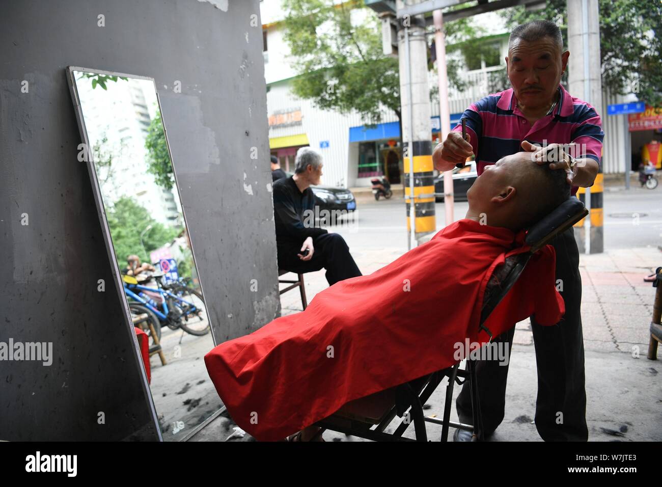 Barber stall hi-res stock photography and images - Alamy