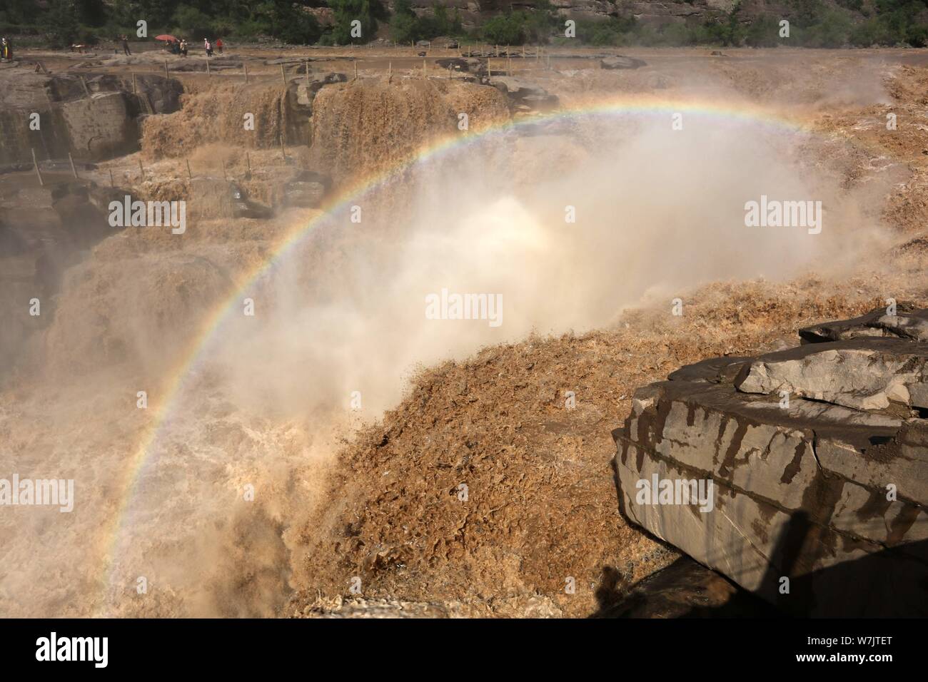 View of a rainbow stretching across the Hukou Waterfall on the Yellow ...