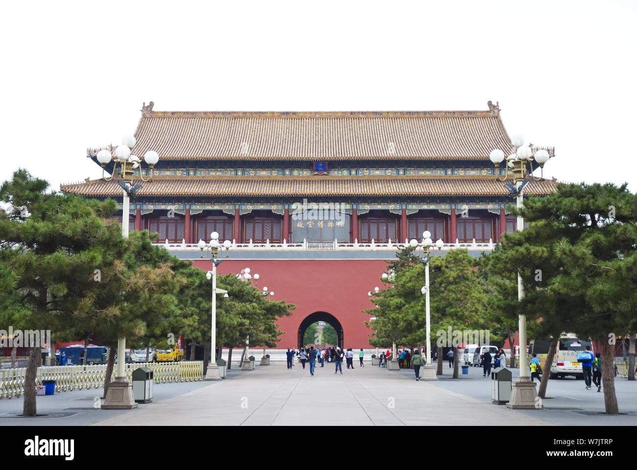 Tourists walk through the Upright Gate, or the Duanmen Gate installed a ...