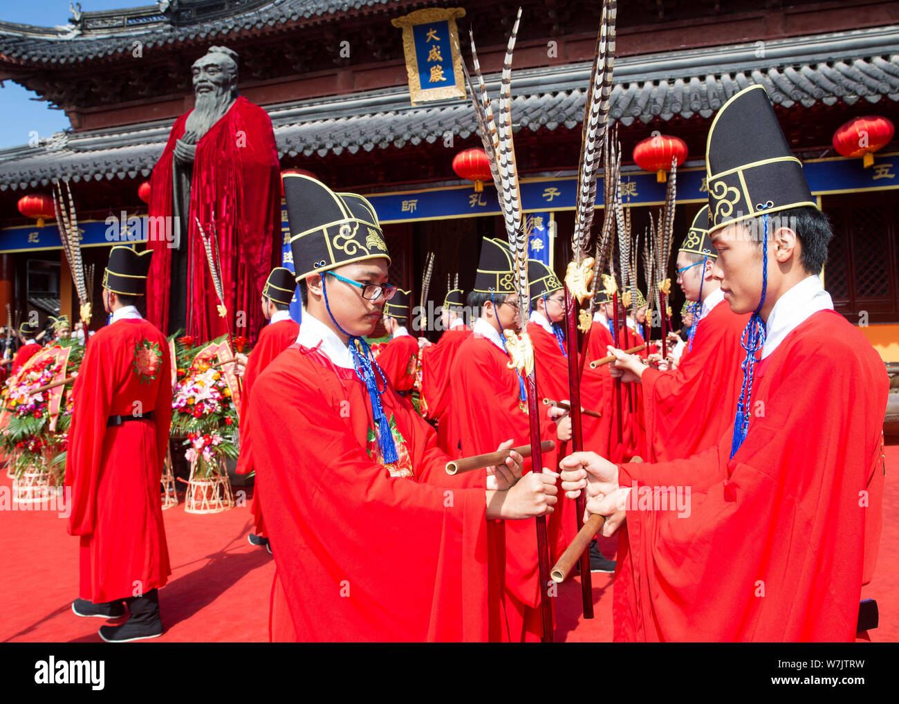 Participants dressed in traditional costumes perform a ritual to mark ...