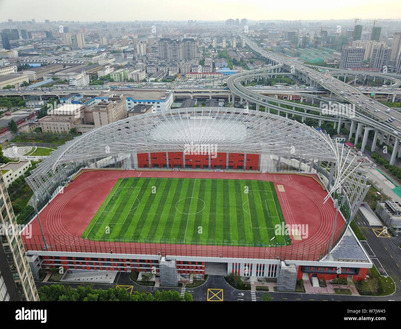 --FILE--Aerial view of Shanghai's first full-sized rooftop football ...