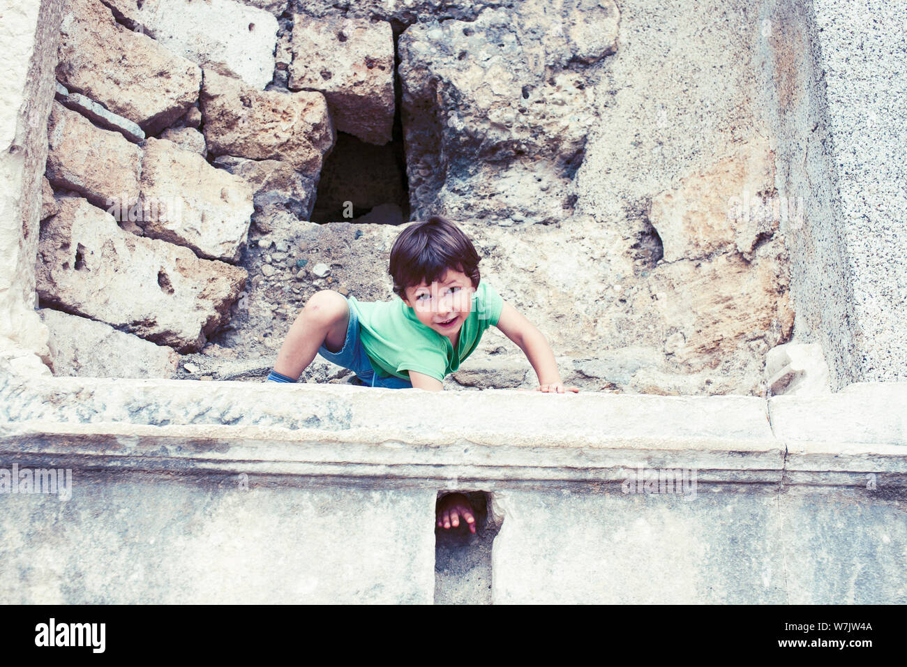 little boy exploring ancient architecture, lifestyle people on summer ...