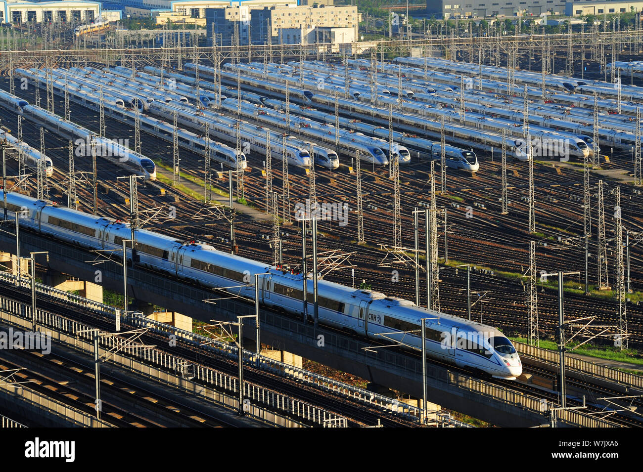 A high-speed bullet train leaves the Shanghai Hongqiao Railway Station ...